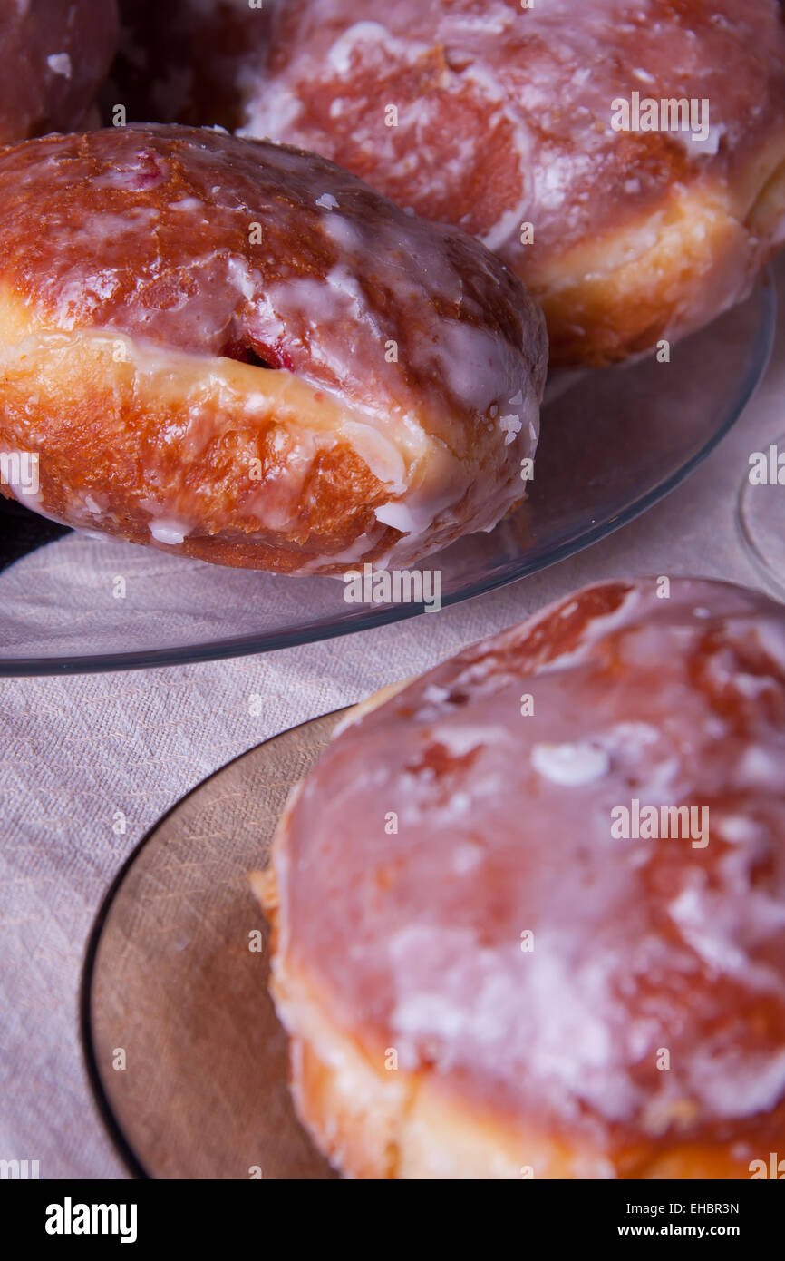 Delicious donuts stuffed with jam with an icing-sugar coat Stock Photo ...