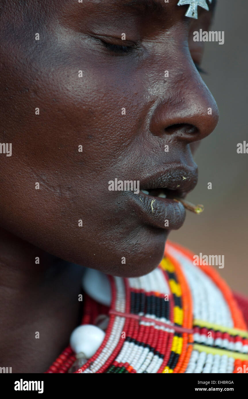 Close-up of a Samburu woman with beaded colorful necklaces and a metal ...