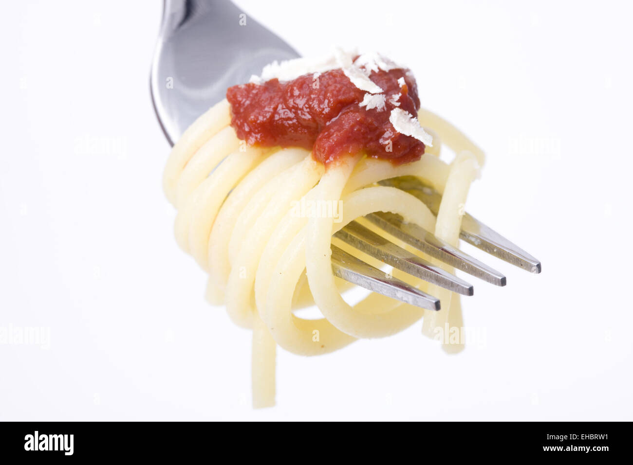 spaghetti on a fork over white background Stock Photo - Alamy