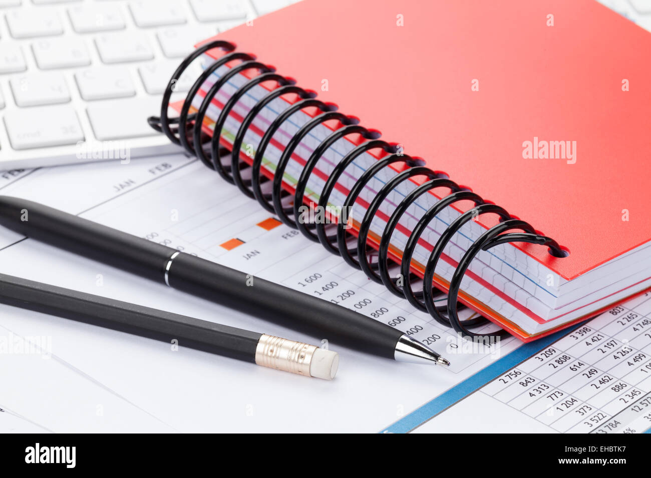 Office desk with reports, computer, supplies and notepad closeup Stock ...