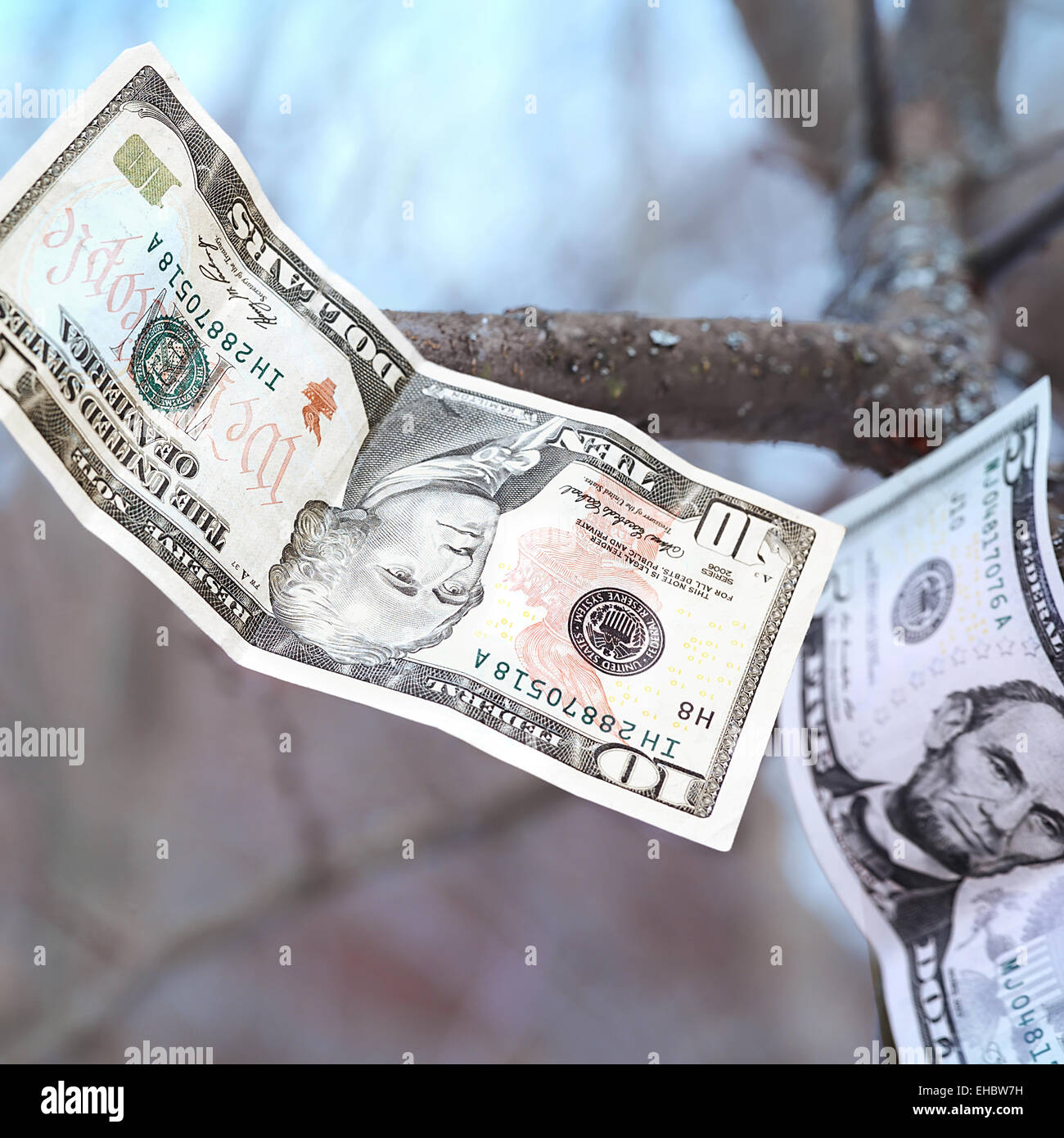 US currency falling Stock Photo - Alamy