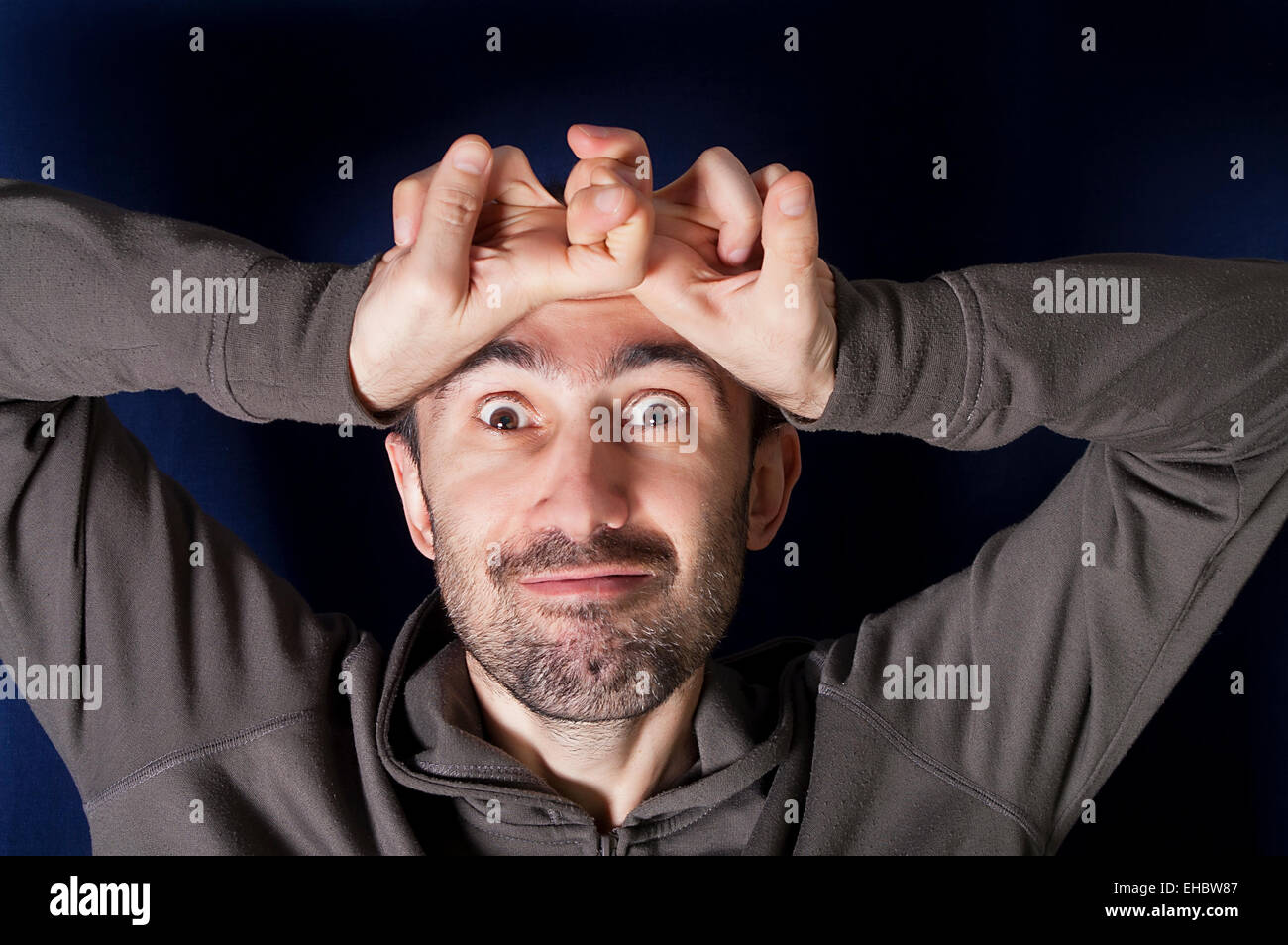 Man making face, studio shot Stock Photo - Alamy
