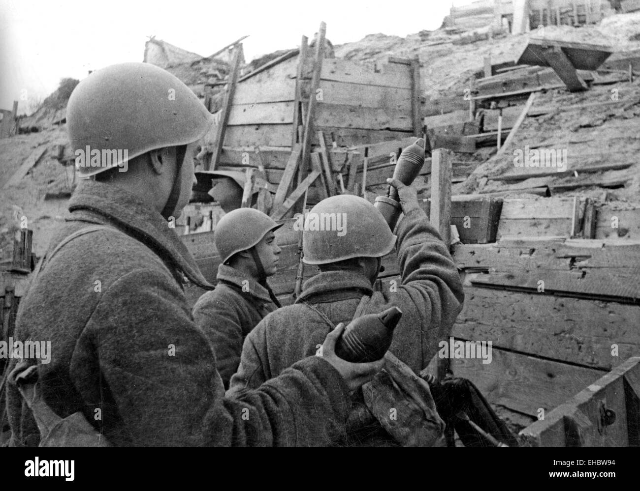 SOVIET MORTAR UNIT preparing to fire in 1944. They are wearing the ...