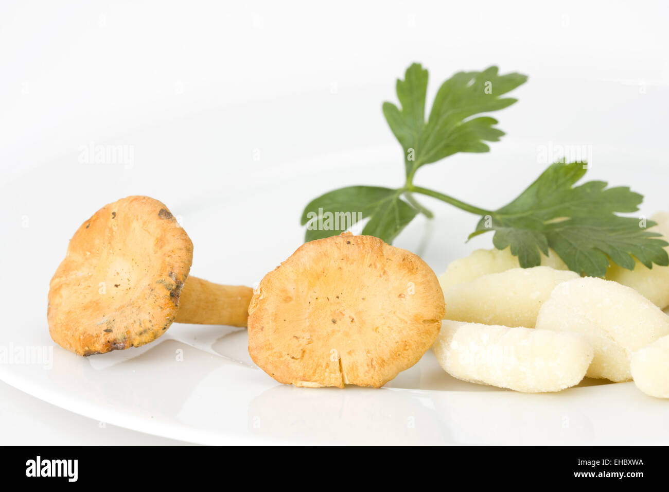 uncooked gnocchi noodles on a plate Stock Photo - Alamy
