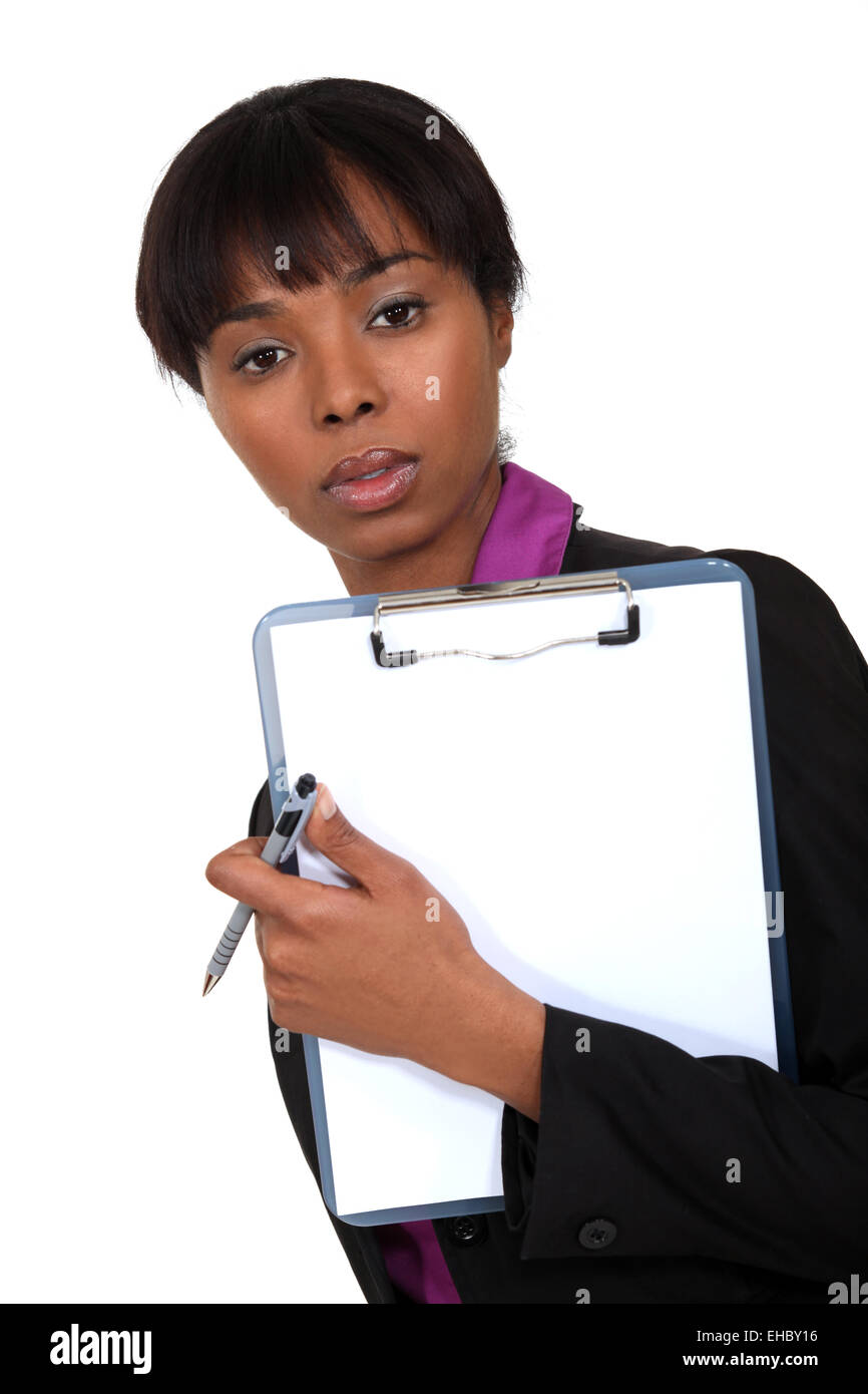 Businessman holding clip-board and pen Stock Photo - Alamy