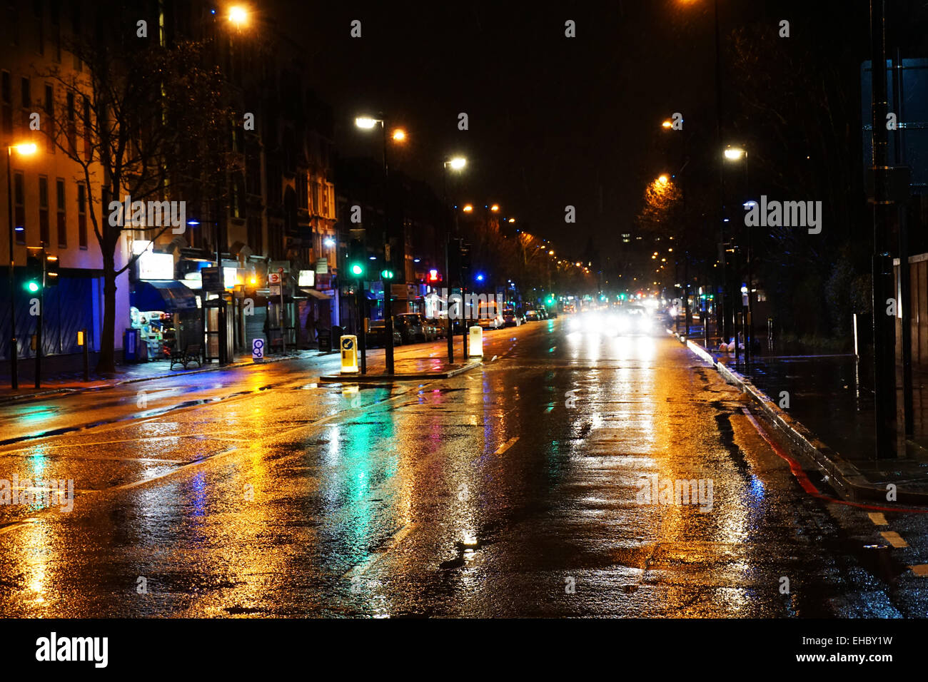 Wet City Streets At Night A Wet City Street At Night With People