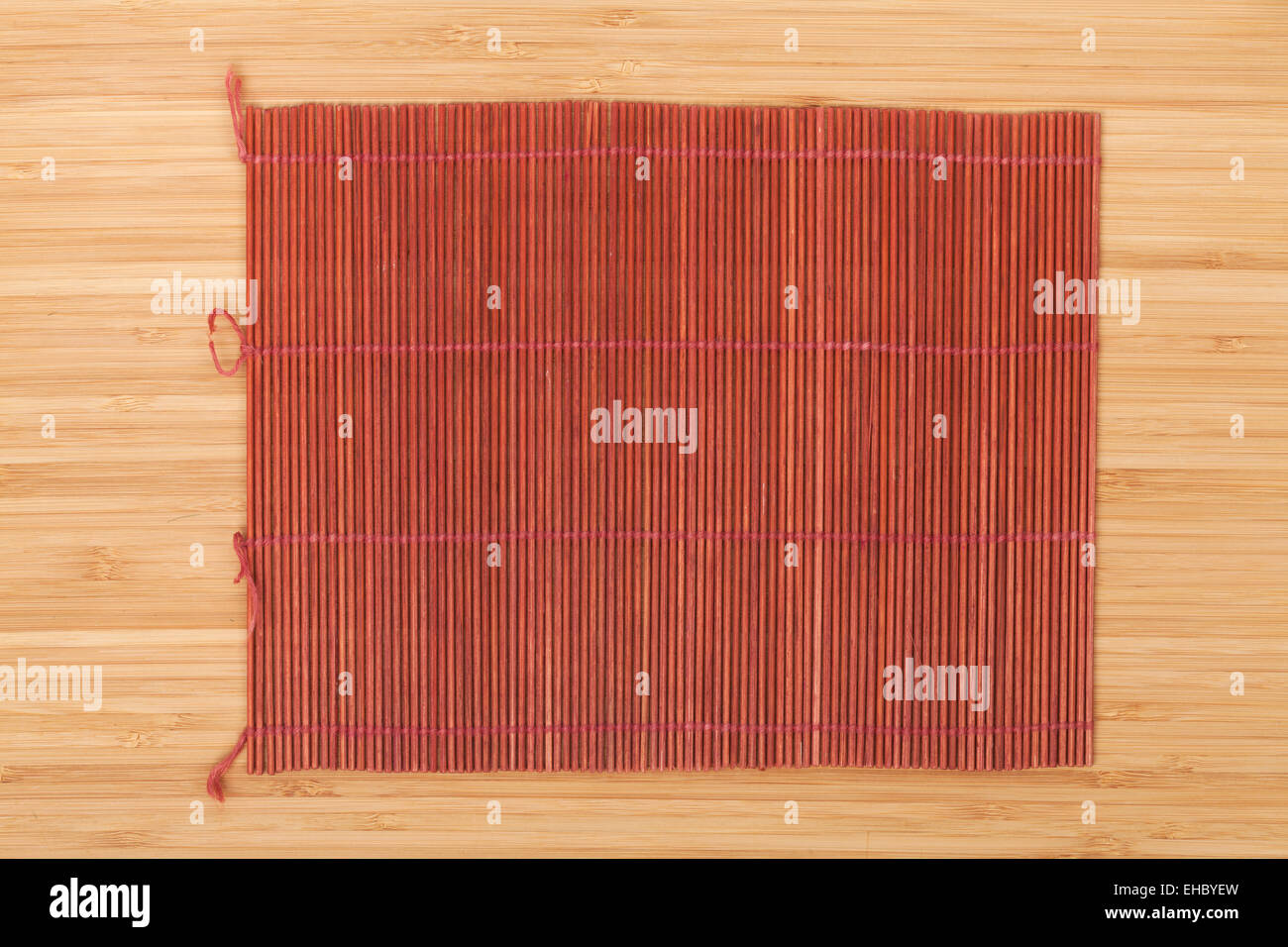 Japanese cooking mat over bamboo table with copy space Stock Photo - Alamy