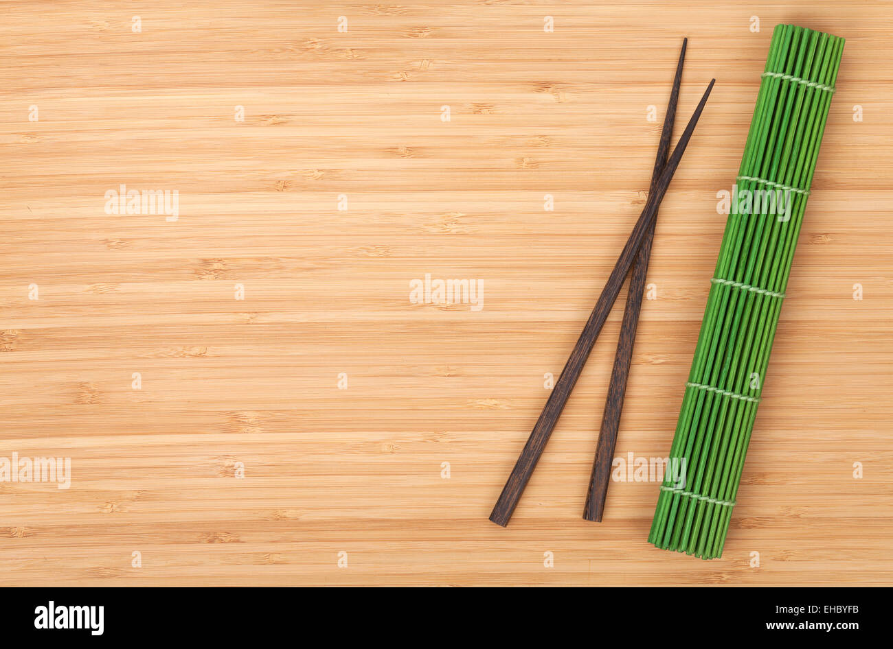 Chopsticks and bamboo mat on table with copy space Stock Photo - Alamy