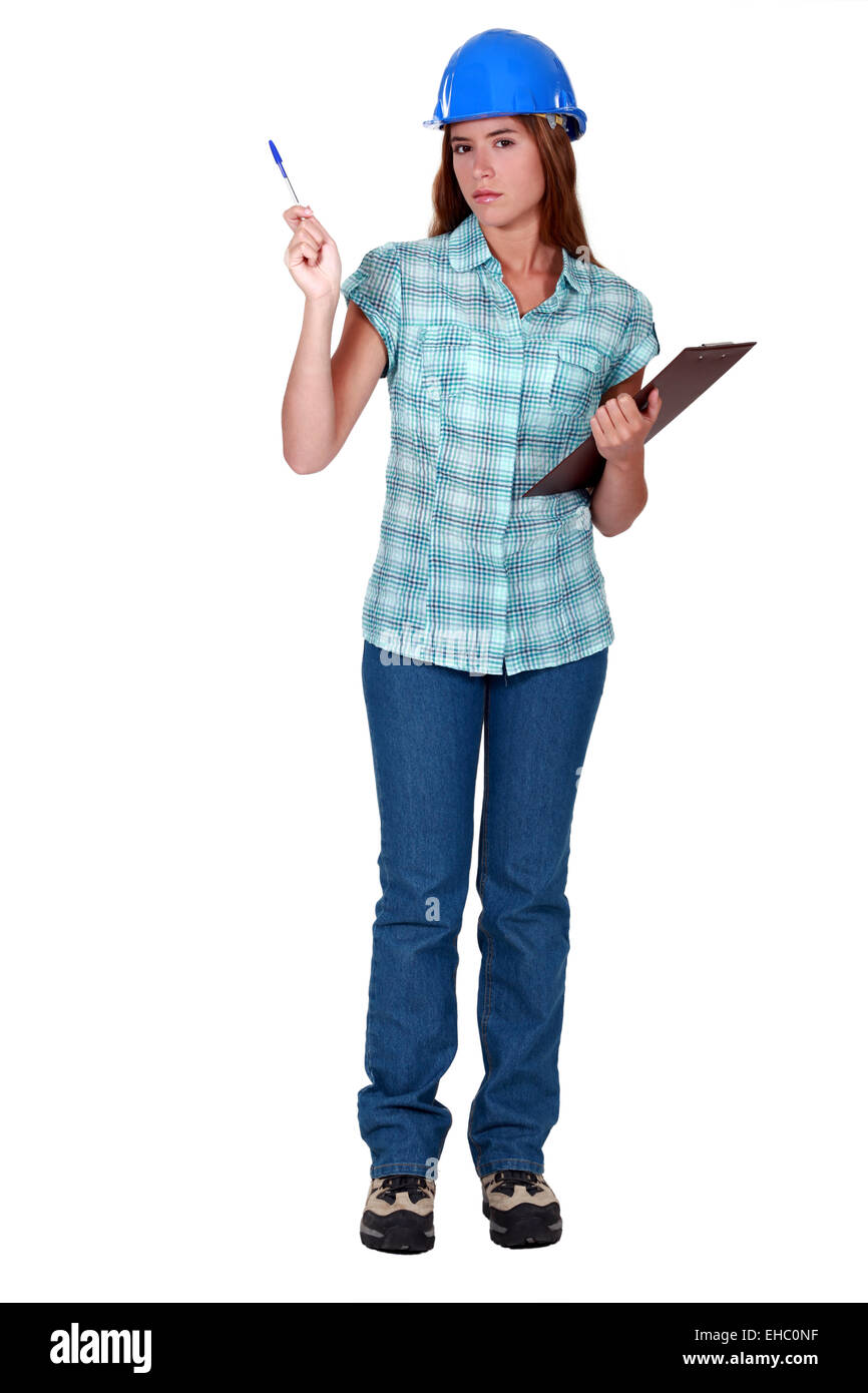 Female inspector holding clipboard Stock Photo - Alamy