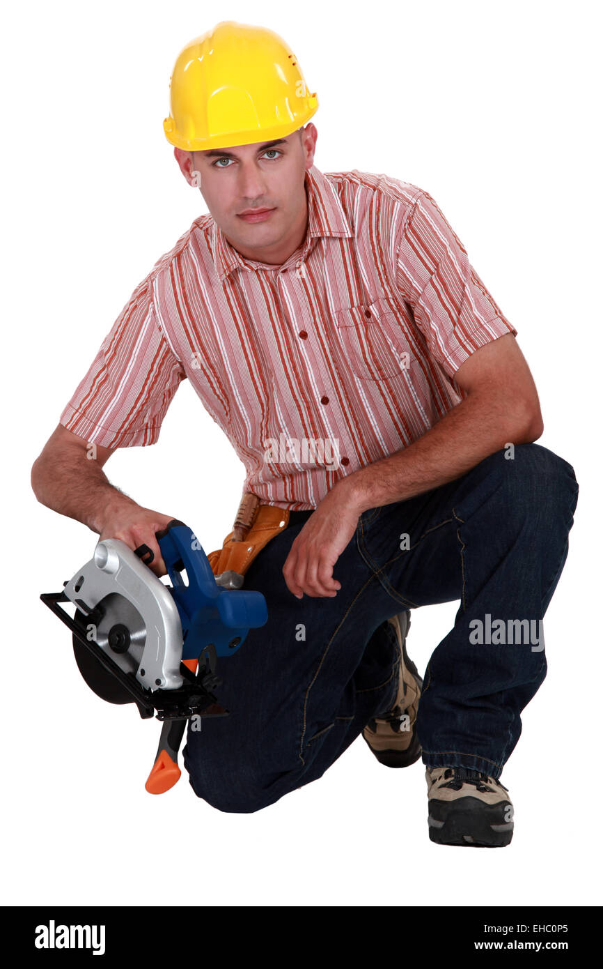 Woodworker with saw Stock Photo - Alamy
