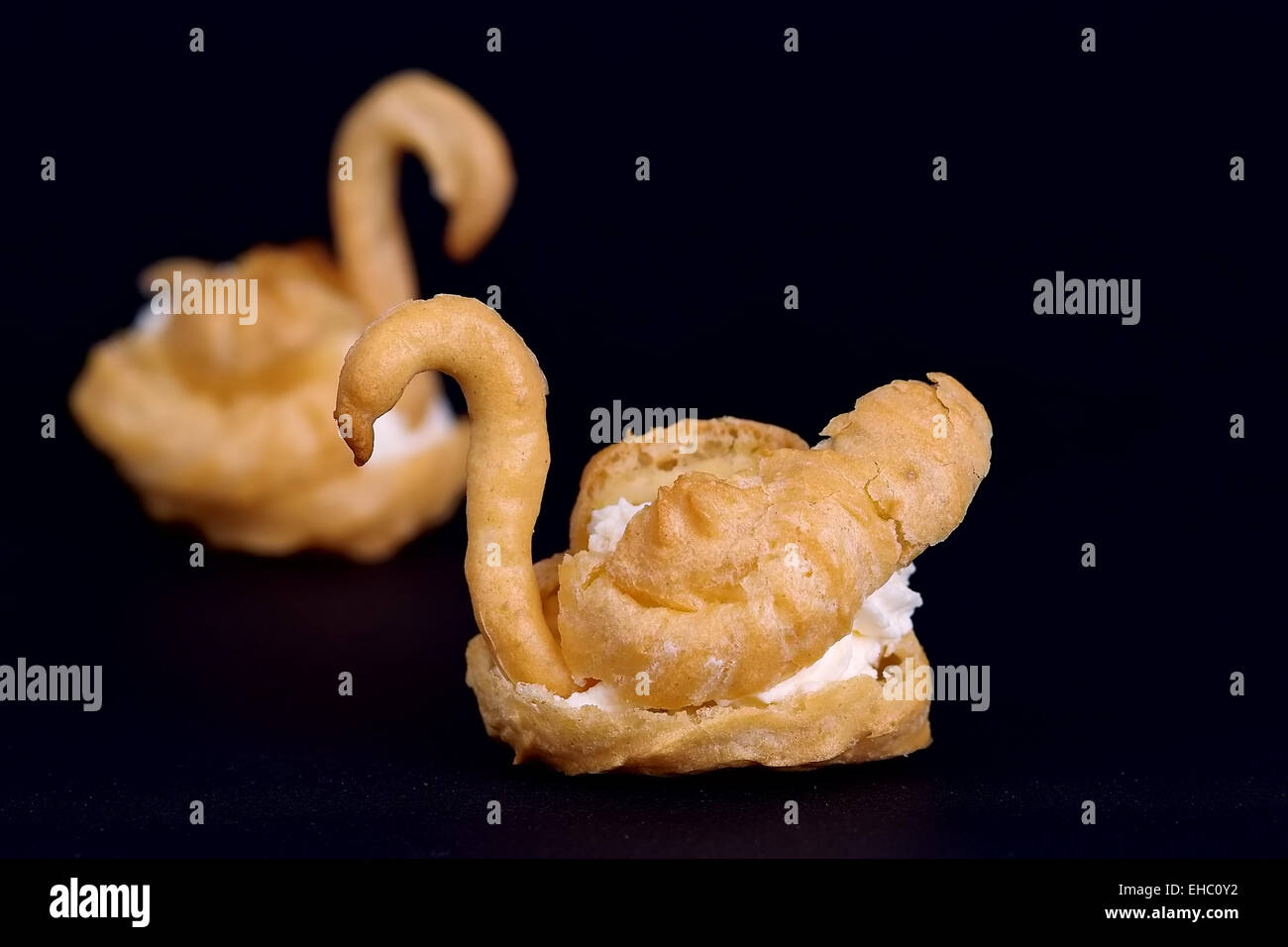choux pastry swans filled with cream Stock Photo - Alamy
