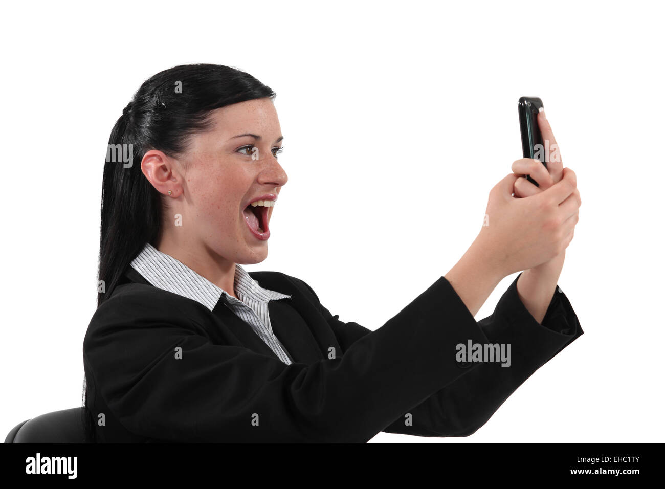 Overjoyed woman reading text message Stock Photo - Alamy