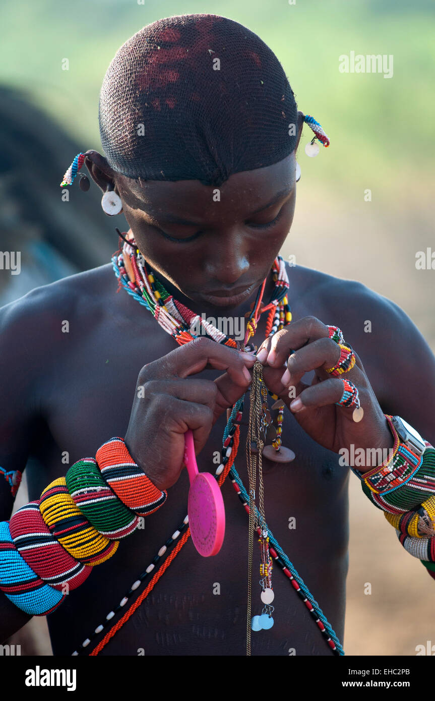 A Samburu Moran (warrior) decorated for a wedding ceremony, Archer's ...