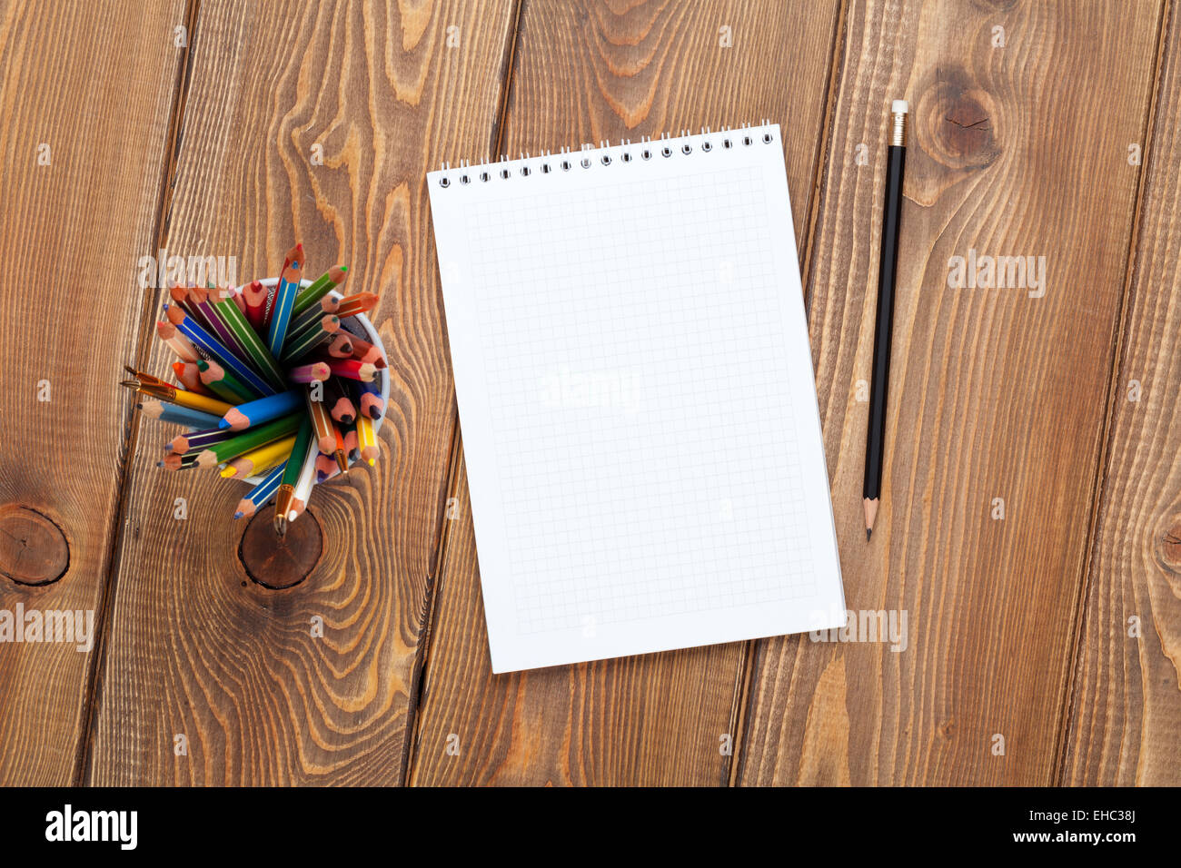 Office desk table with notepad and colorful pencils. Top view with copy ...