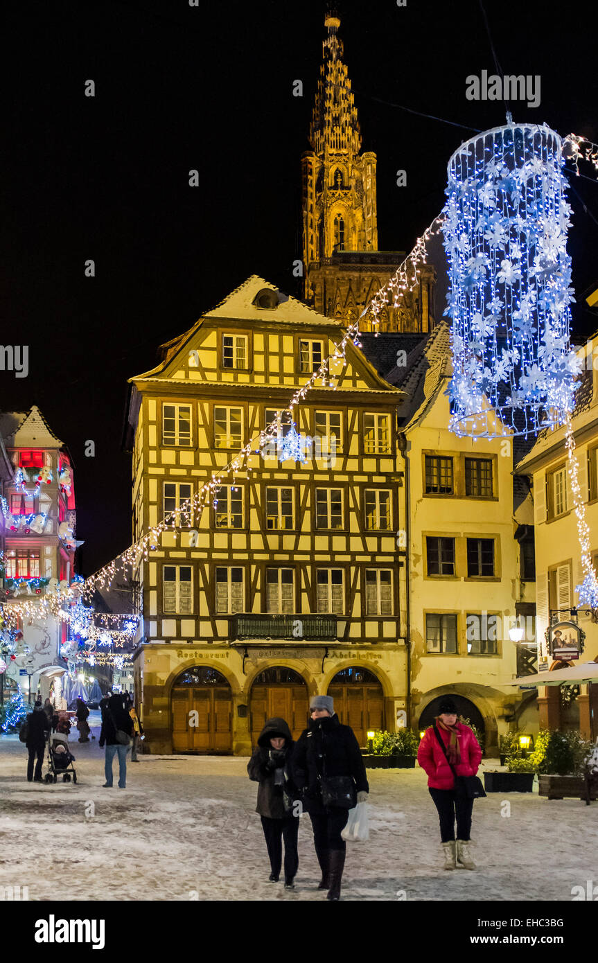 Snowy Place du Marché aux Cochons de Lait square and cathedral at night ...