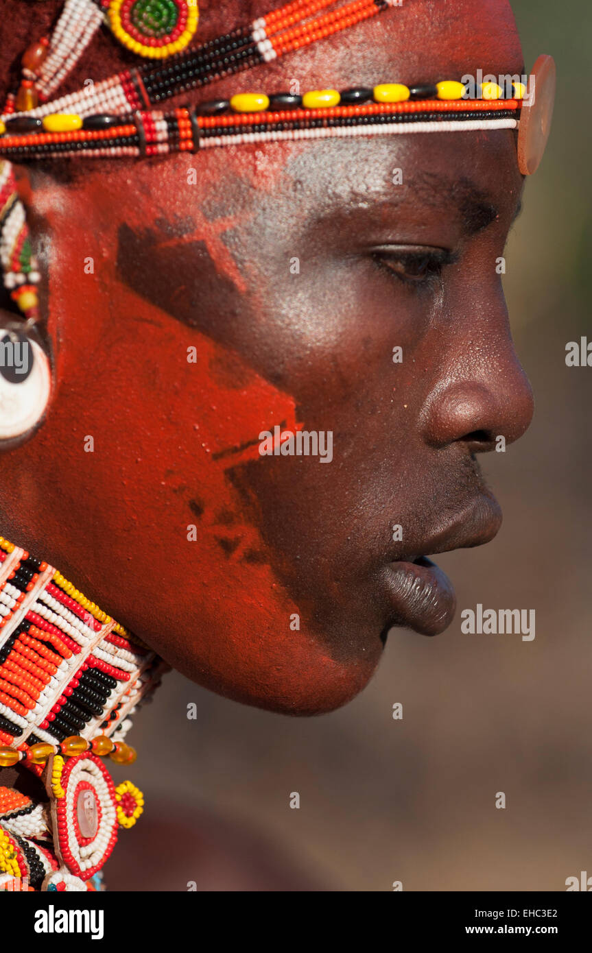 A Samburu Moran (warrior) with face painted with red ochre for a ...
