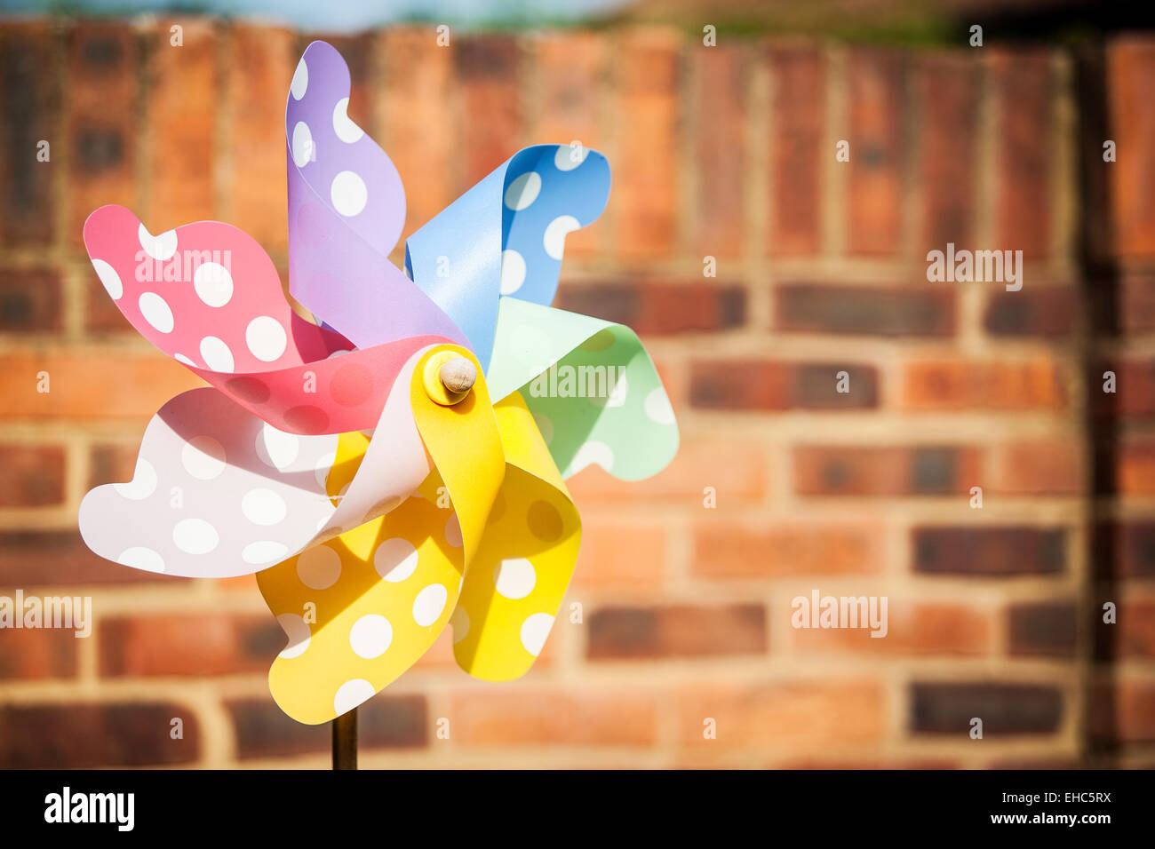 Multi colored pin wheel windmill Stock Photo - Alamy