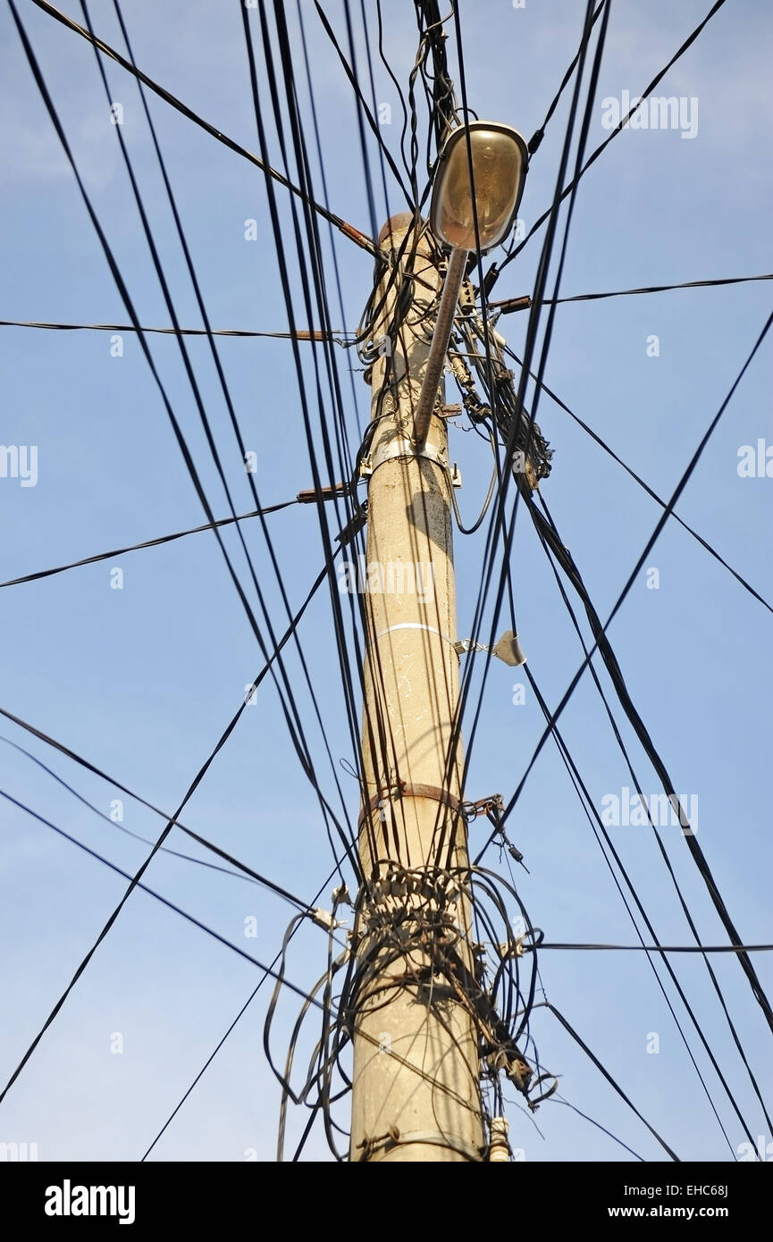 Public electricity pole with lots of tangled wires Stock Photo - Alamy