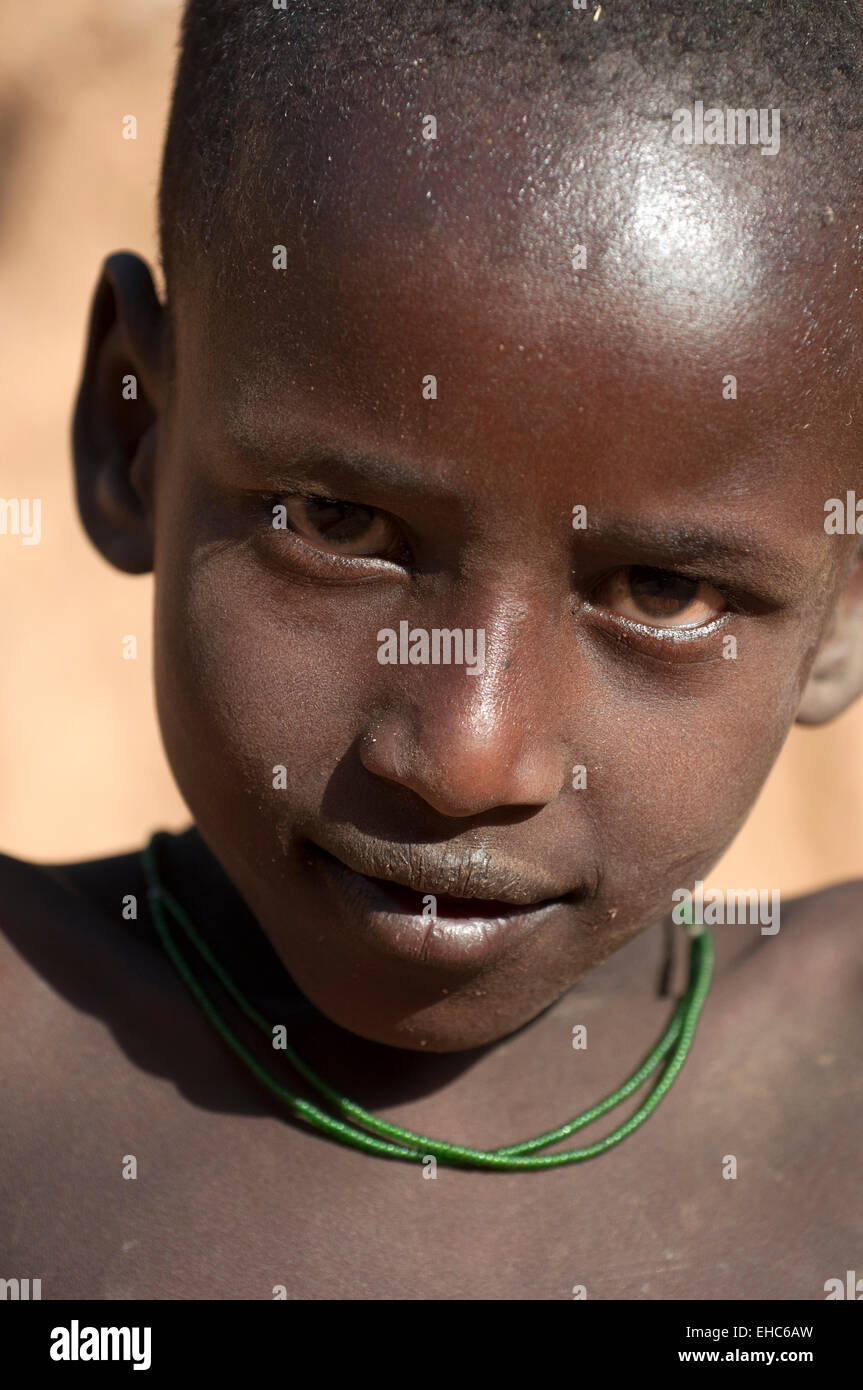 A Samburu child with a green beaded necklace, Ngurunit area, Kenya ...