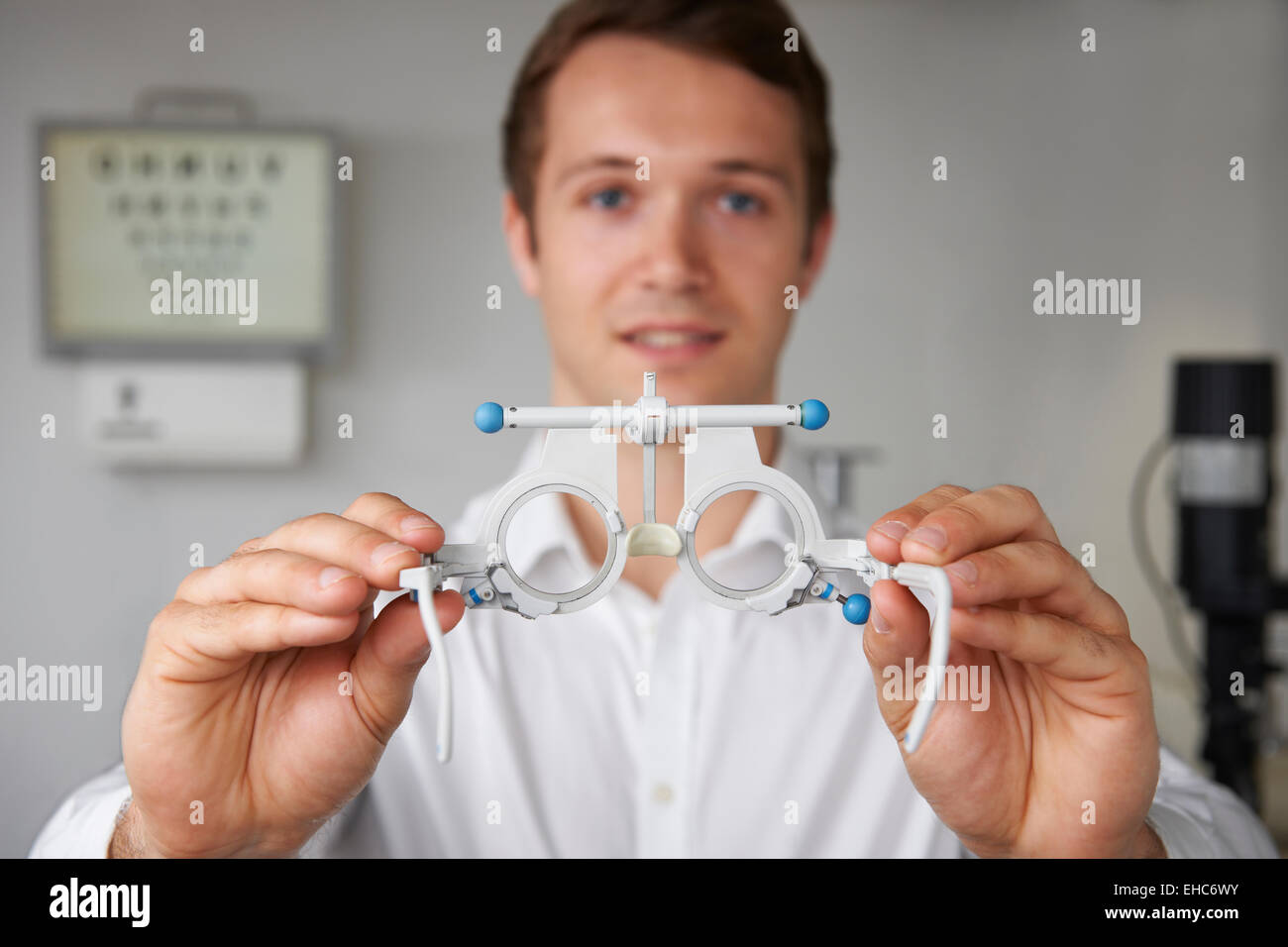 Male Optician Giving Patient Sight Test Stock Photo - Alamy