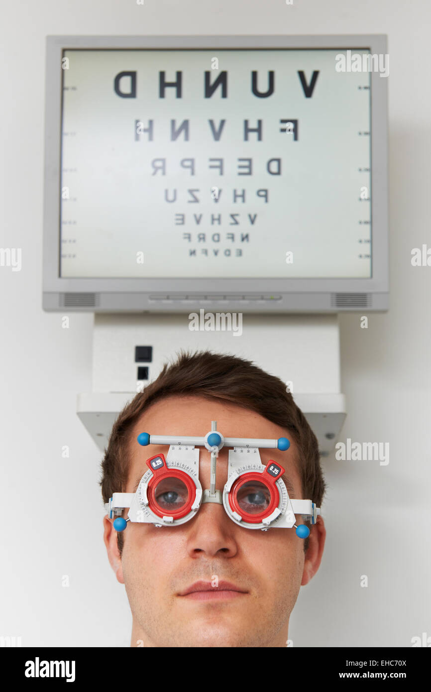 Man Having Sight Test At Optometrist Stock Photo - Alamy