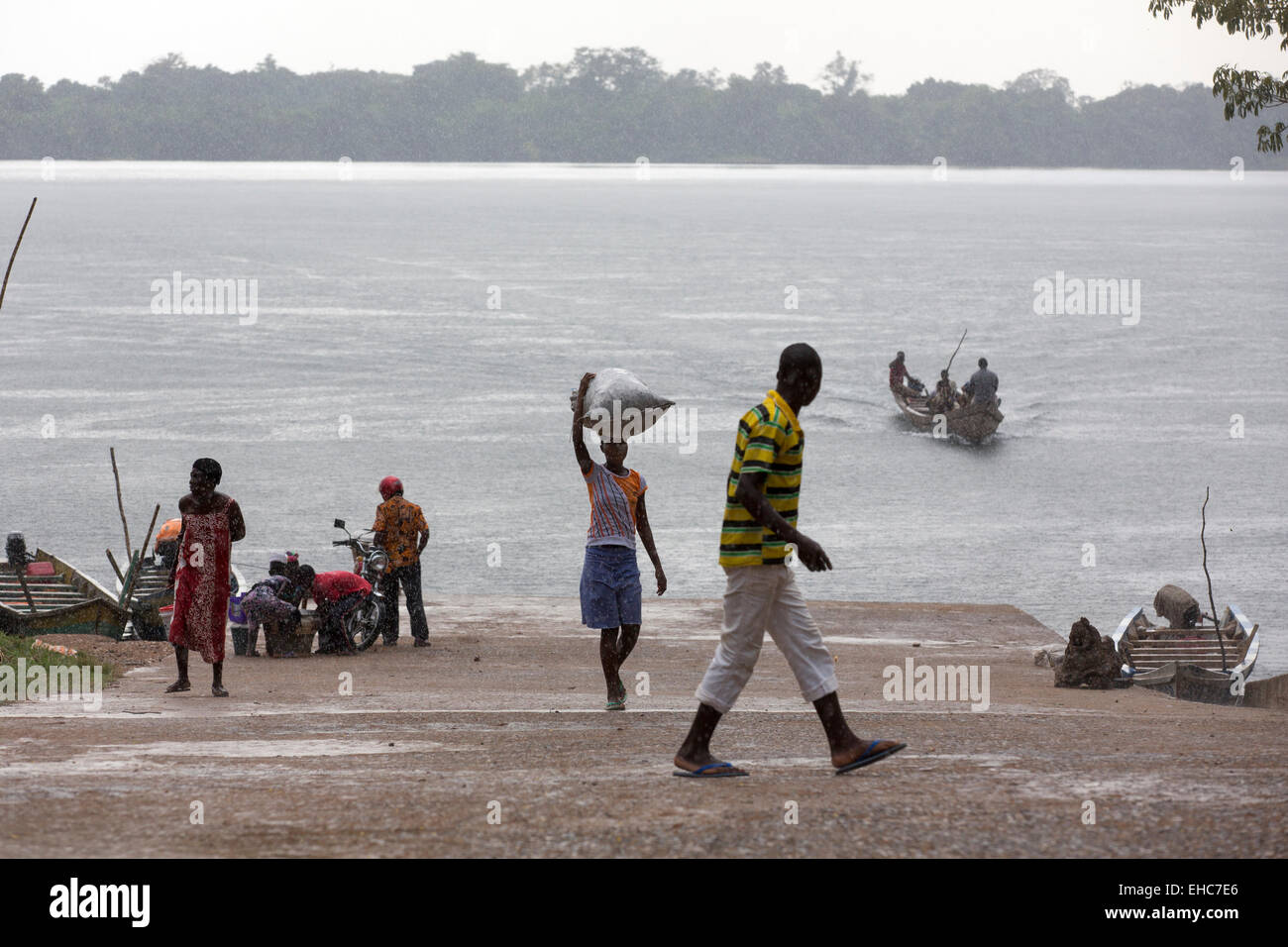 ADIDOME, GHANA, 6th December 2012; A small boat crosses the river ...