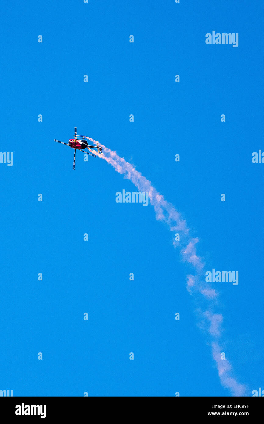 The Red Bull Stunt Helicopter performing Aerobatics at the 2011 Wings ...