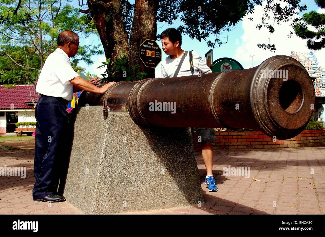 Penang, Malaysia: Visitors on Penang Hill examine an 18th century ...