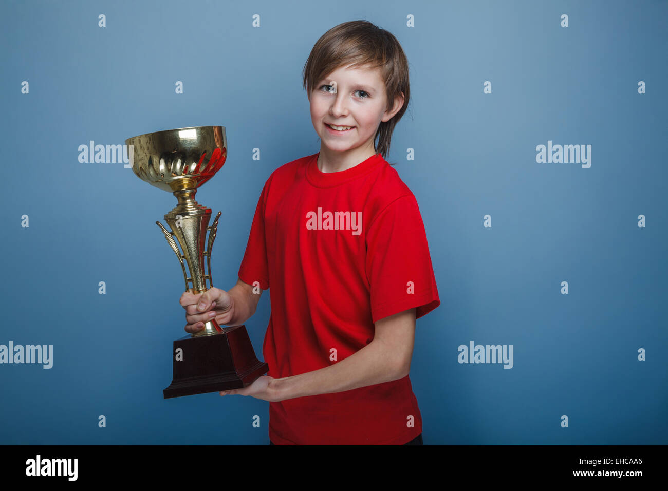 Child winner trophy hi-res stock photography and images - Alamy