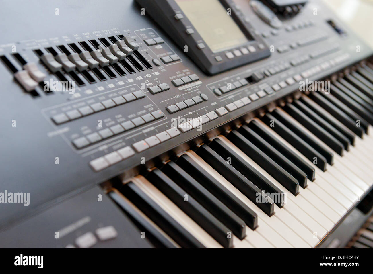 Electronic organ with many buttons and digital display Stock Photo - Alamy
