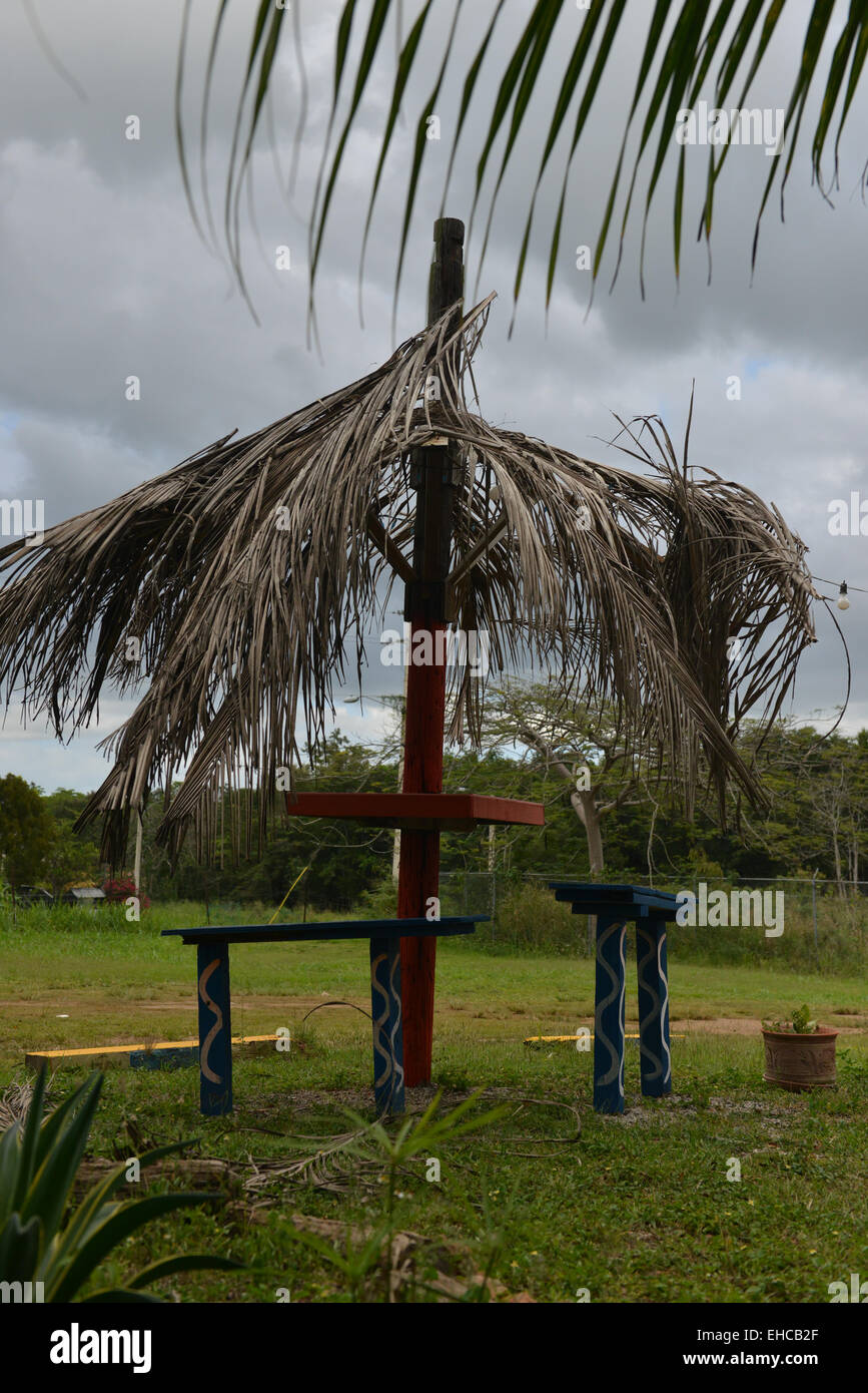 Hut with table and benches in front of a restaurant in the middle of ...