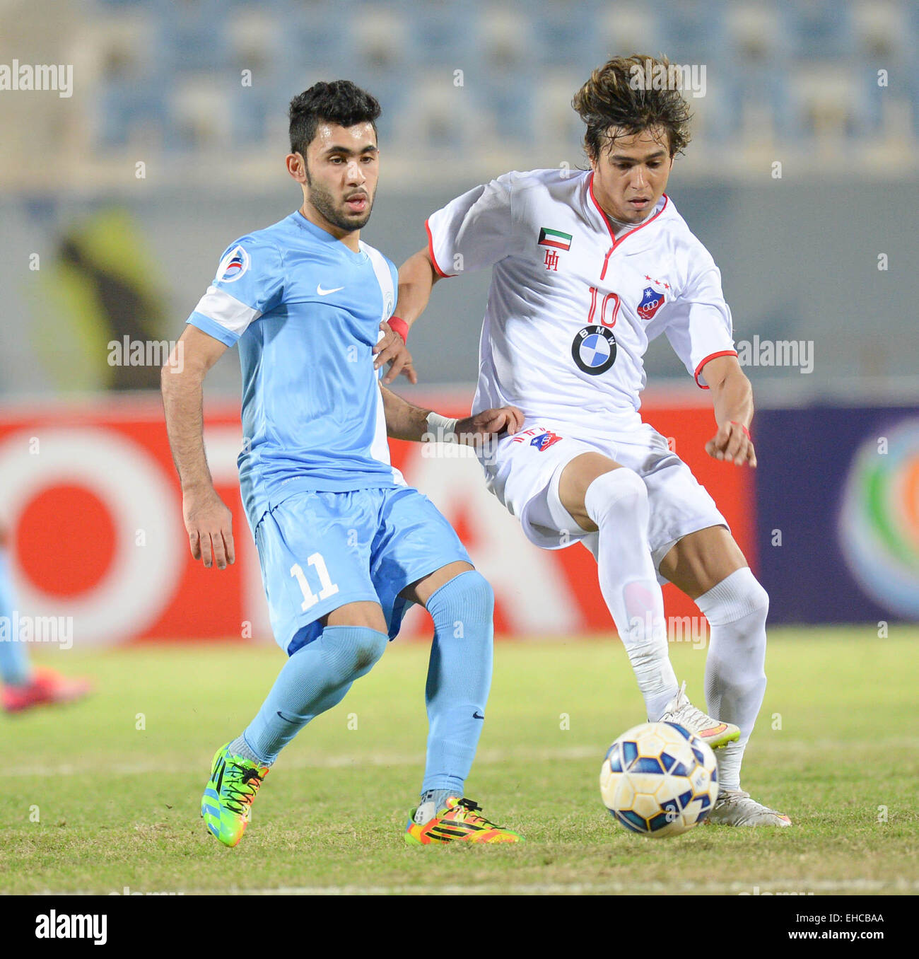 Kuwait City, Kuwait. 11th Mar, 2015. Rojerio De Assis (R) of Kuwait's ...