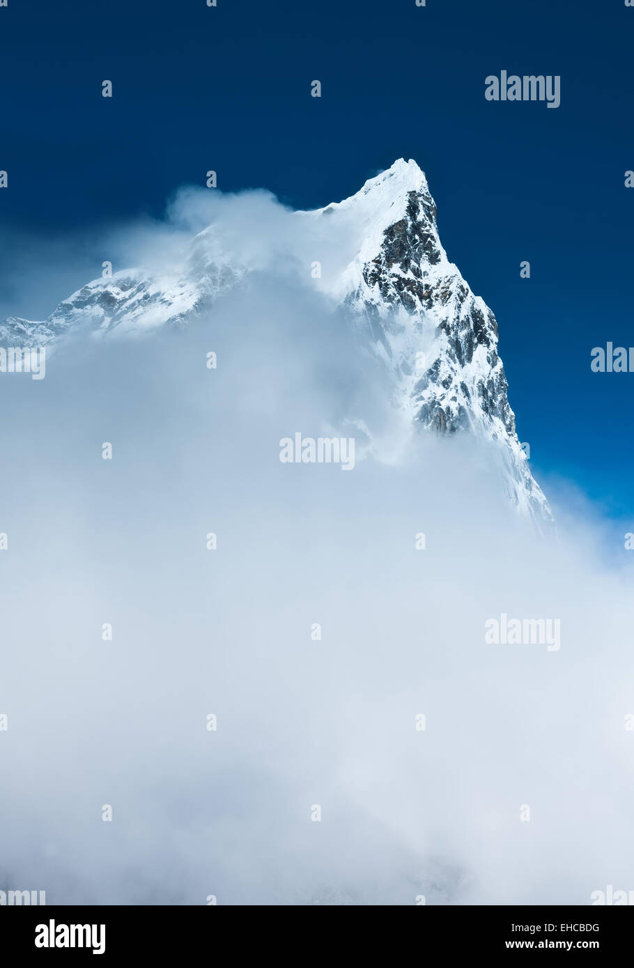 Cholatse (6335m) summit hidden in clouds. Pictured in Nepal Stock Photo ...