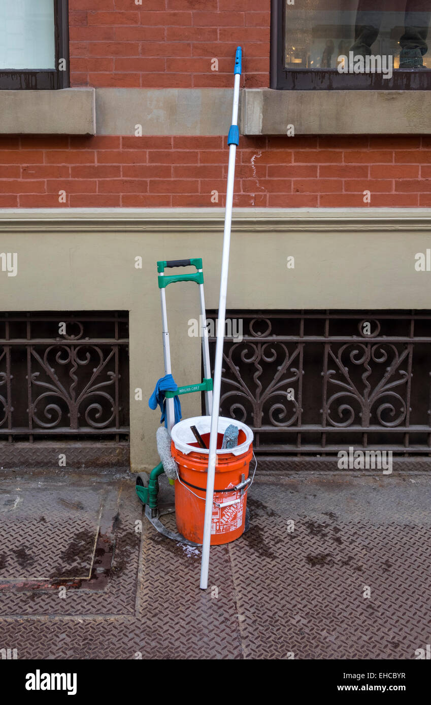 A window warshers kit on the street in New York City Stock Photo - Alamy