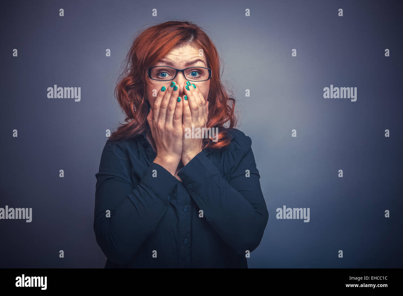 European-looking woman of thirty years covers mouth with her Stock ...