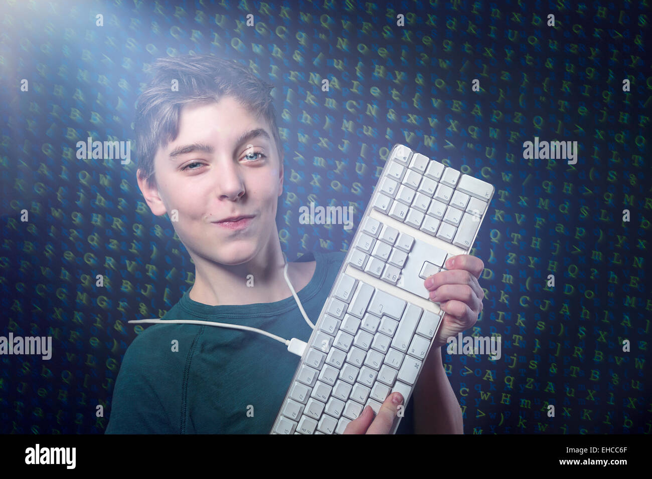smiling teenage boy with computer keyboard and letters salad as ...