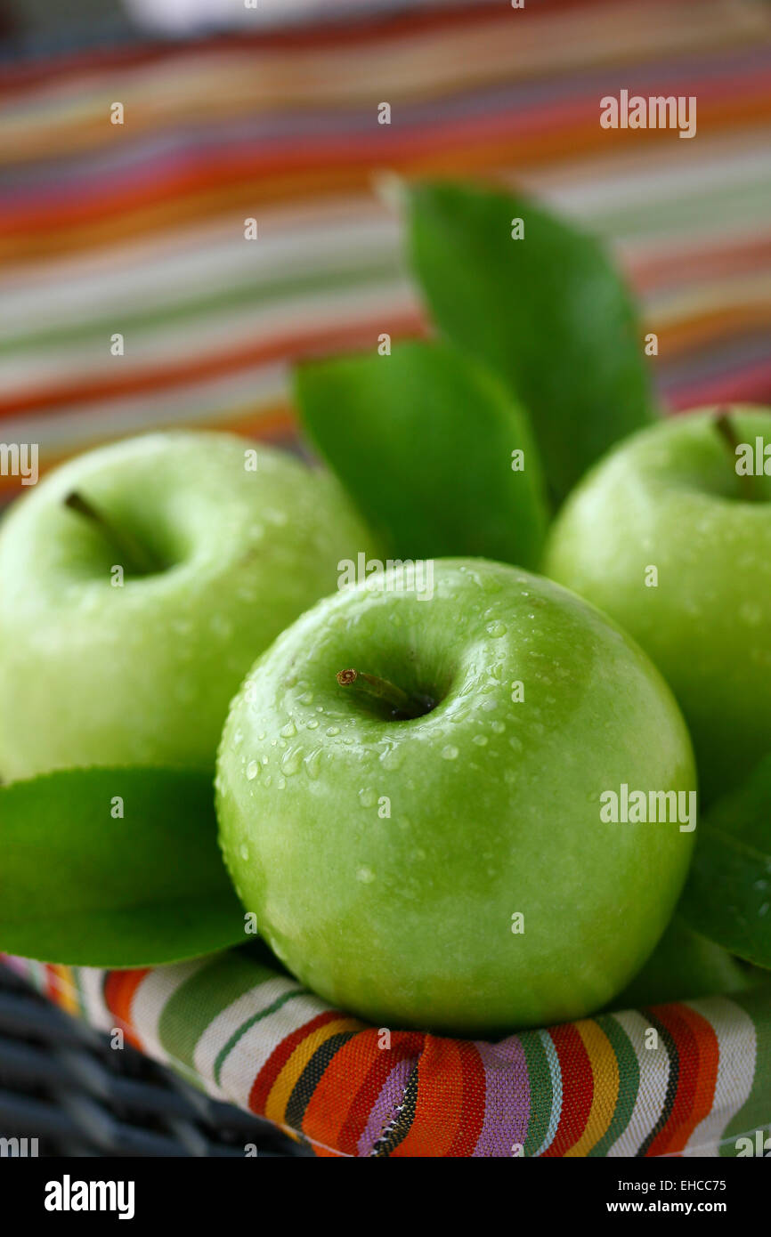 Granny smith apples in fruit basket hi-res stock photography and images ...