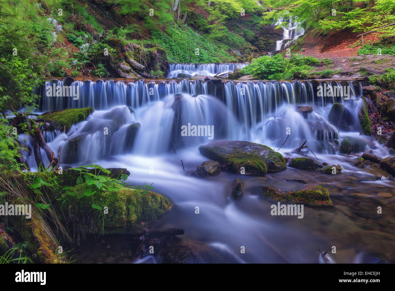 waterfall on mountain in summer time Stock Photo - Alamy