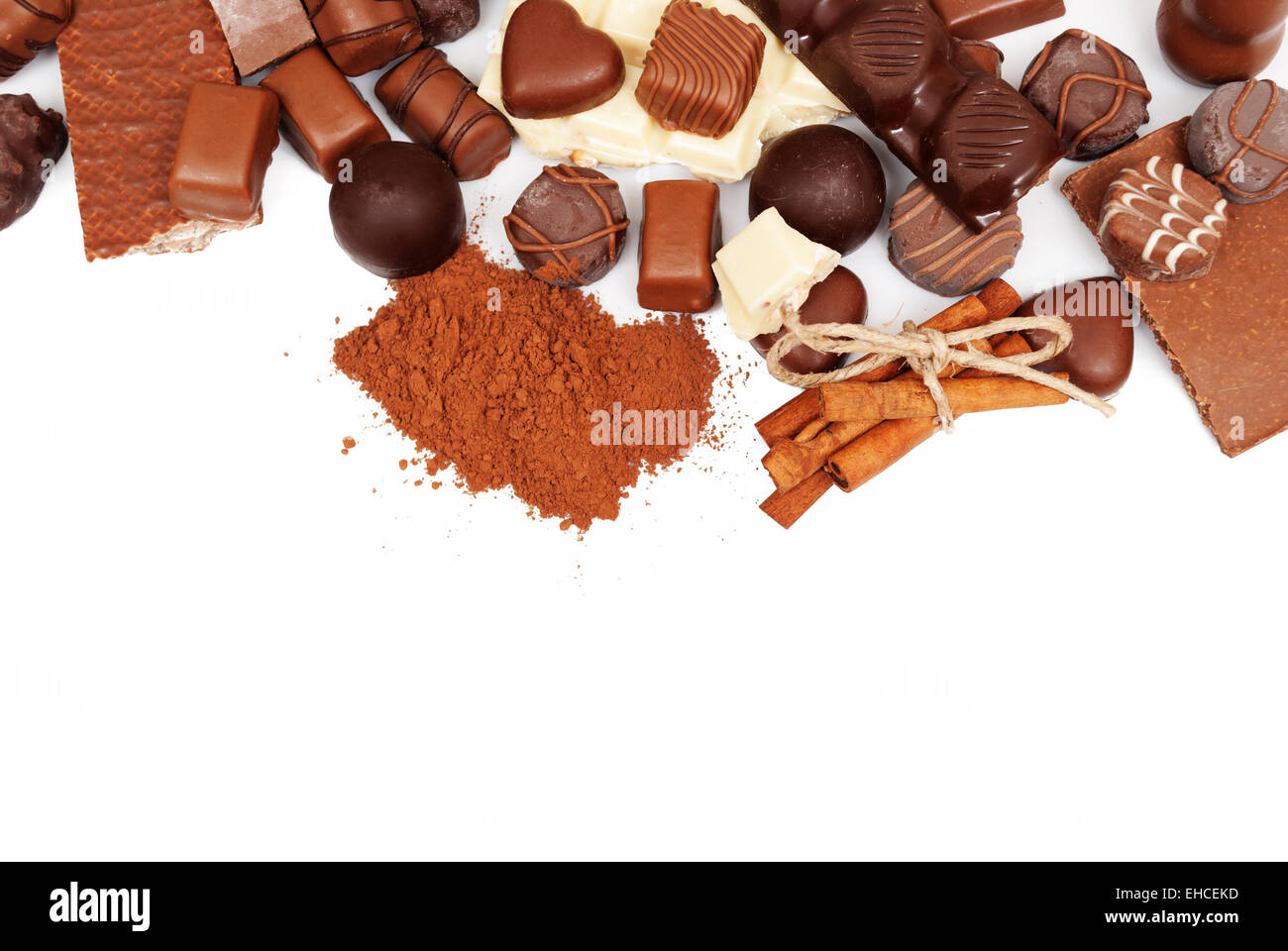 Many chocolate and cinnamon isolated on white background Stock Photo ...
