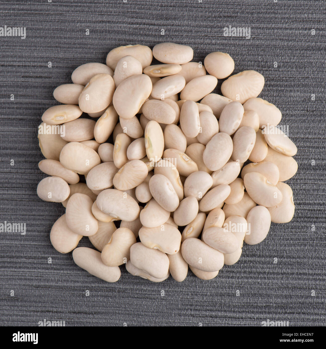 Top view of circle of white beans against white vinyl background Stock ...