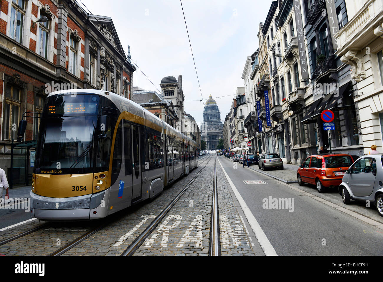 A tram in Brussels. Saint Mary church in the background Stock Photo - Alamy