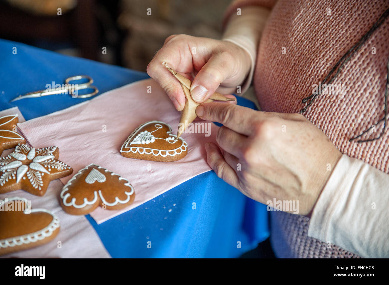 Person decorating gingerbread cookies hi-res stock photography and ...