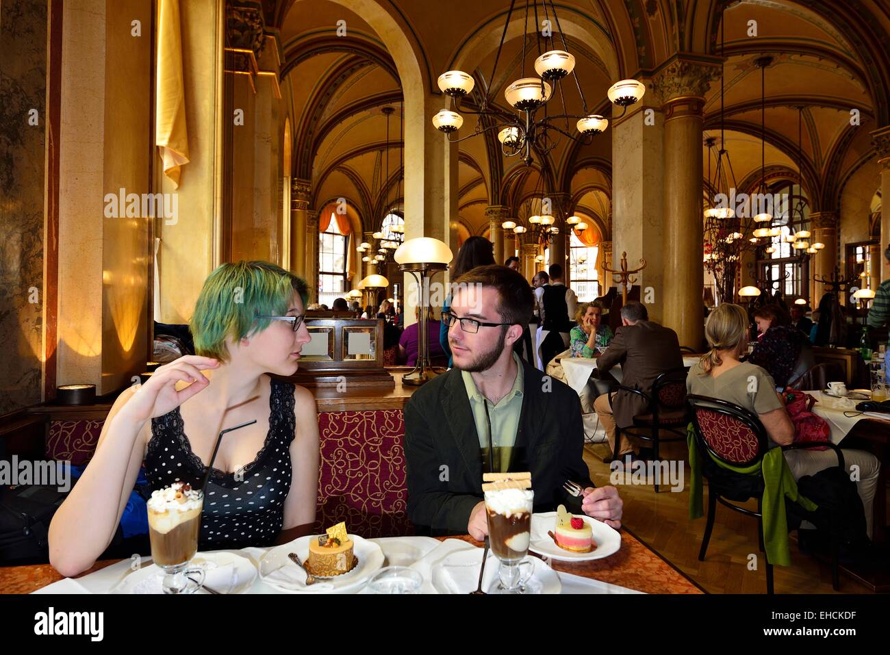 Female sitting café table hi-res stock photography and images - Alamy