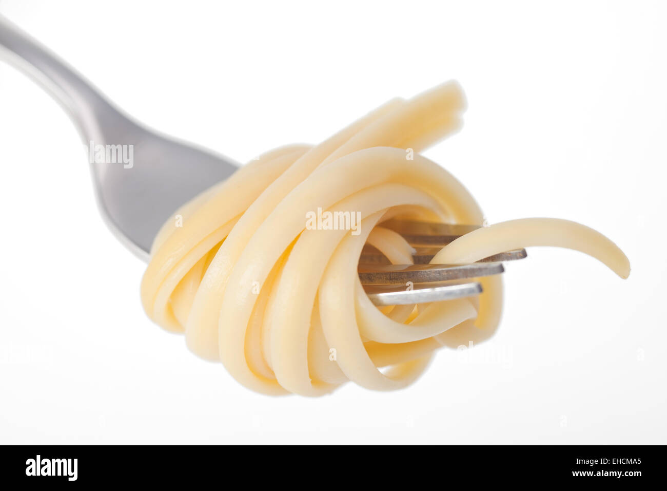 spaghetti on a fork on white background Stock Photo - Alamy