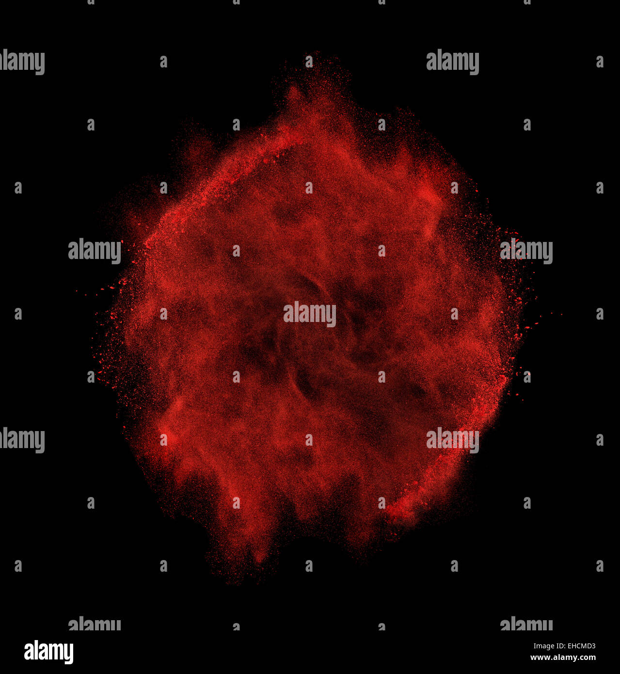 Freeze motion of red dust explosion isolated on black background Stock ...