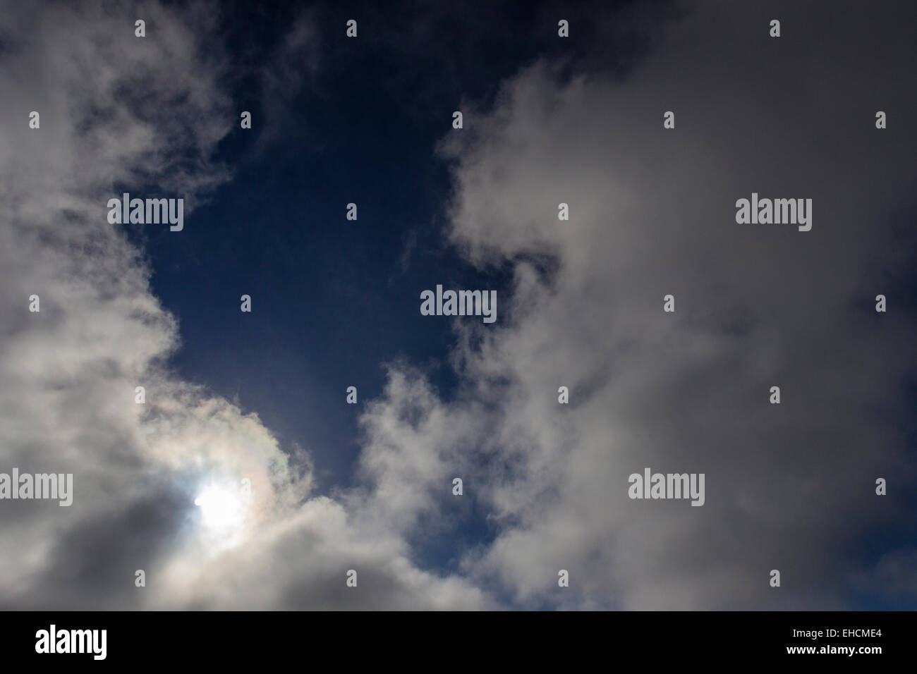 Sun bursting through clouds Stock Photo - Alamy