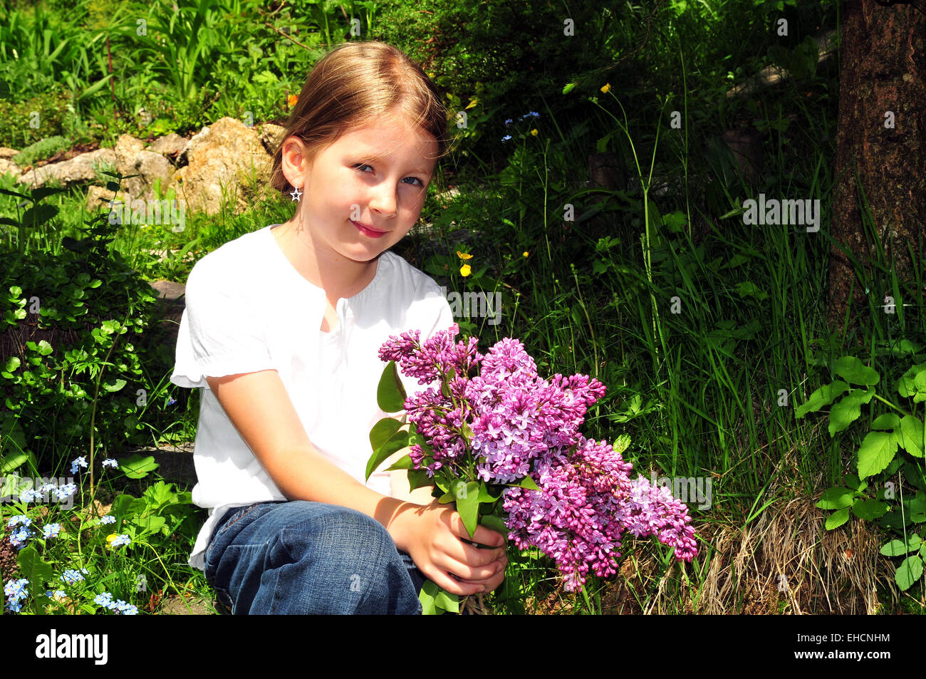 Child with flowers Stock Photo - Alamy
