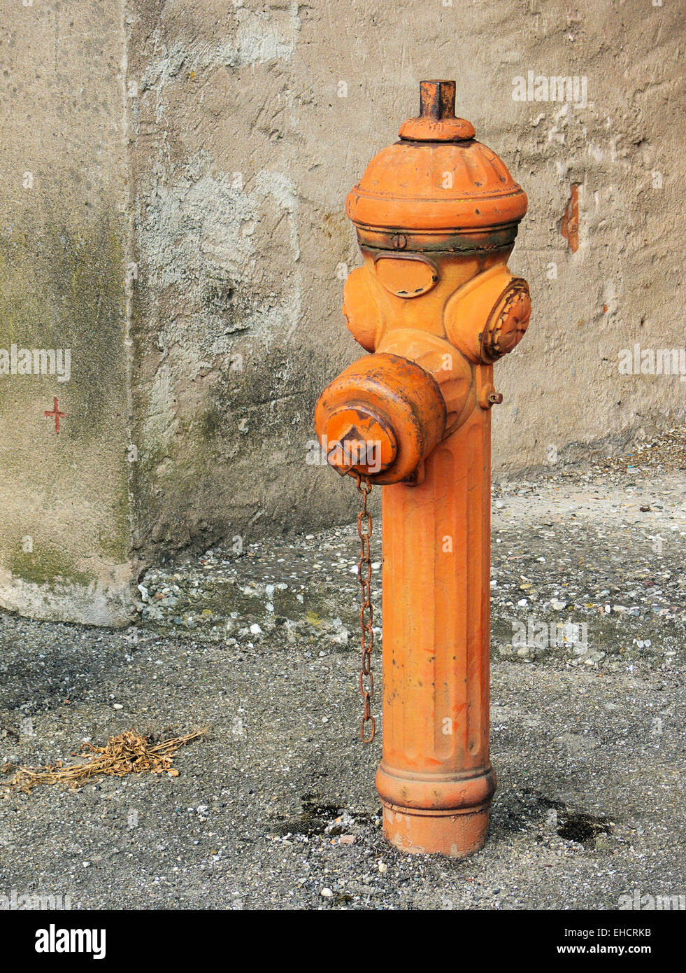 Orange pillar hydrant Stock Photo - Alamy