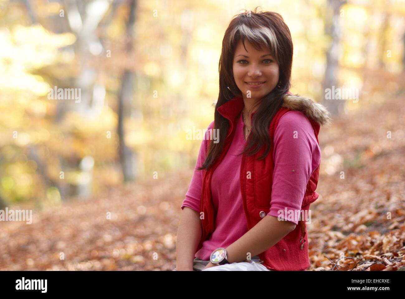 Beautiful girl with falling leaves in the autumn park Stock Photo - Alamy