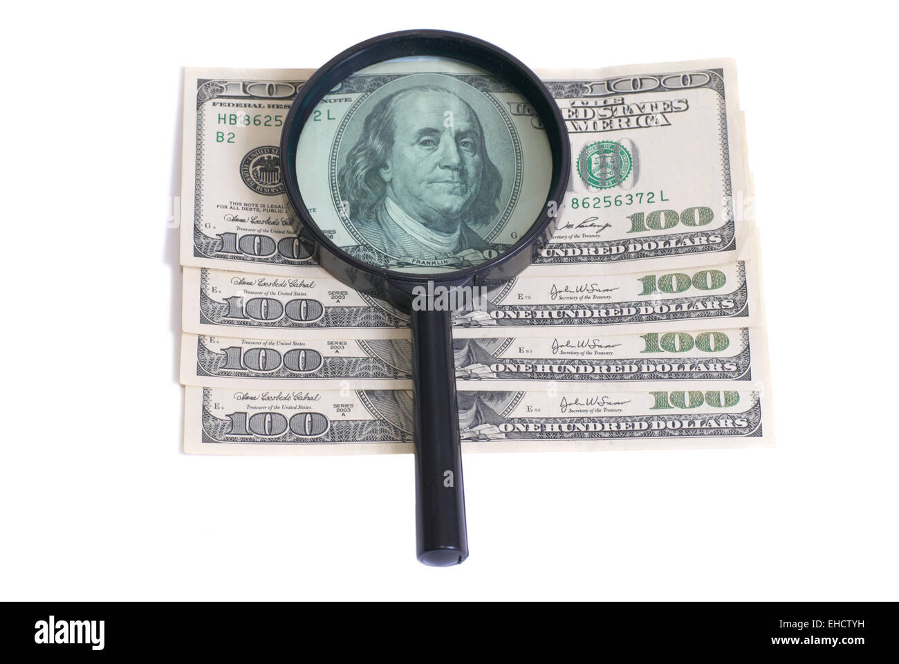 Magnifier with dollars isolated on white background Stock Photo - Alamy
